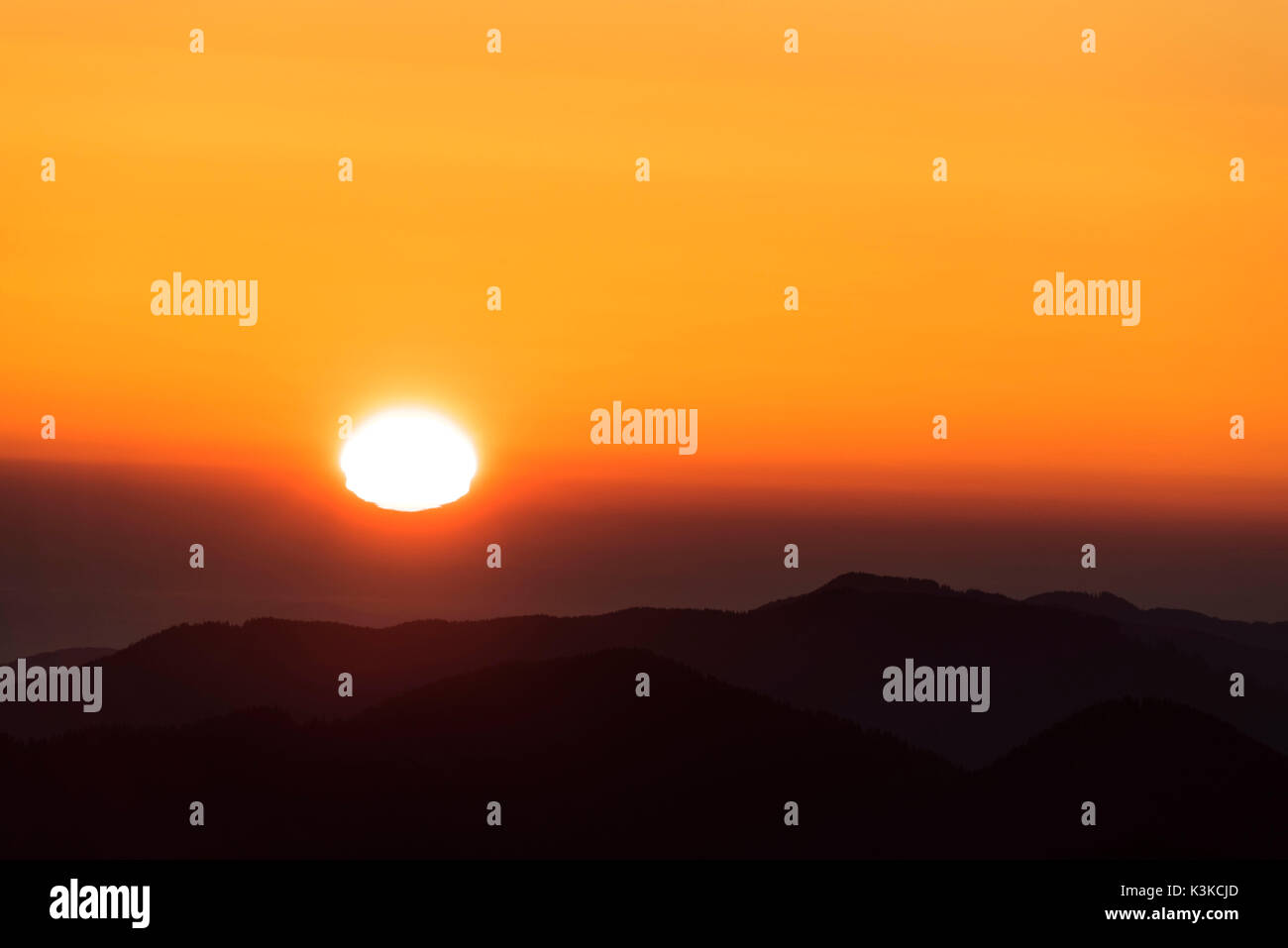 Glowing red sundown seen from the Benediktenwand Stock Photo - Alamy