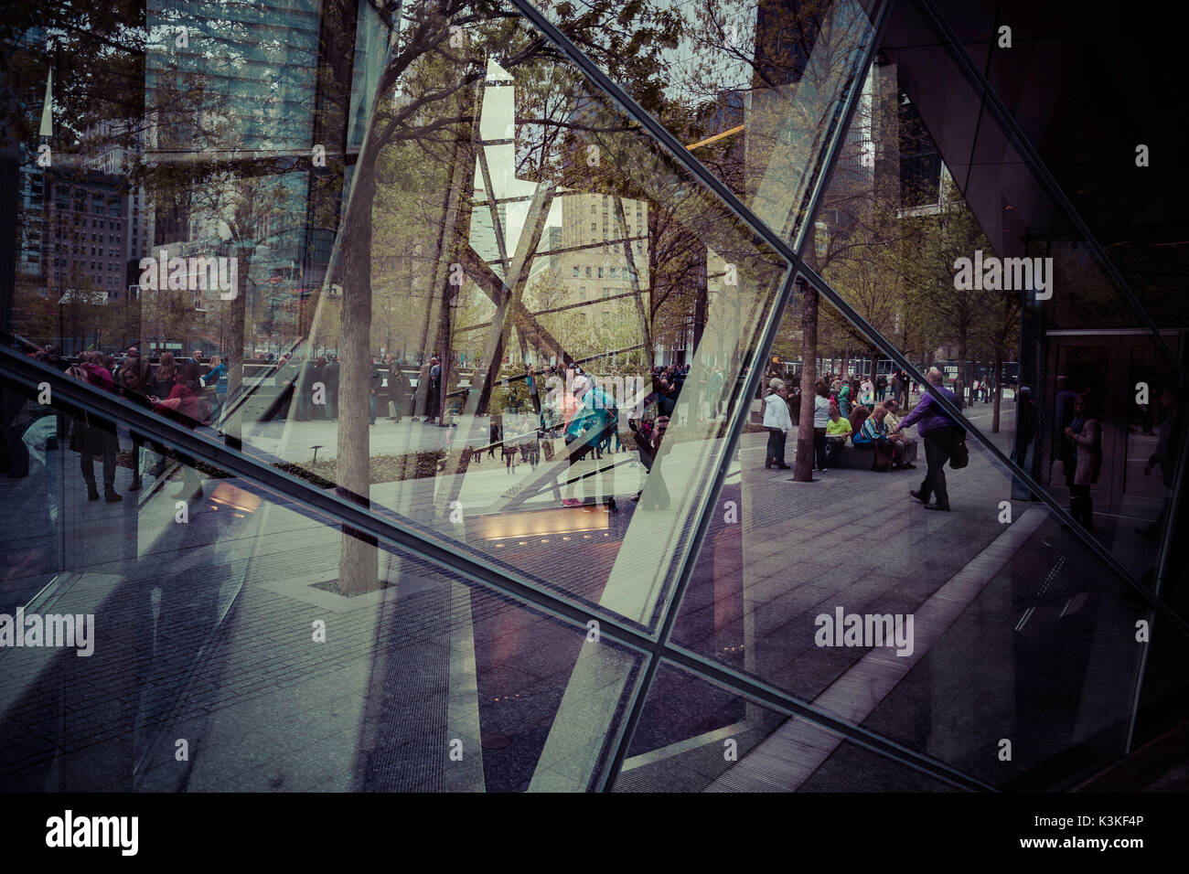 Visitors in reflection of National 9/11 Memorial, World Trade Center ...