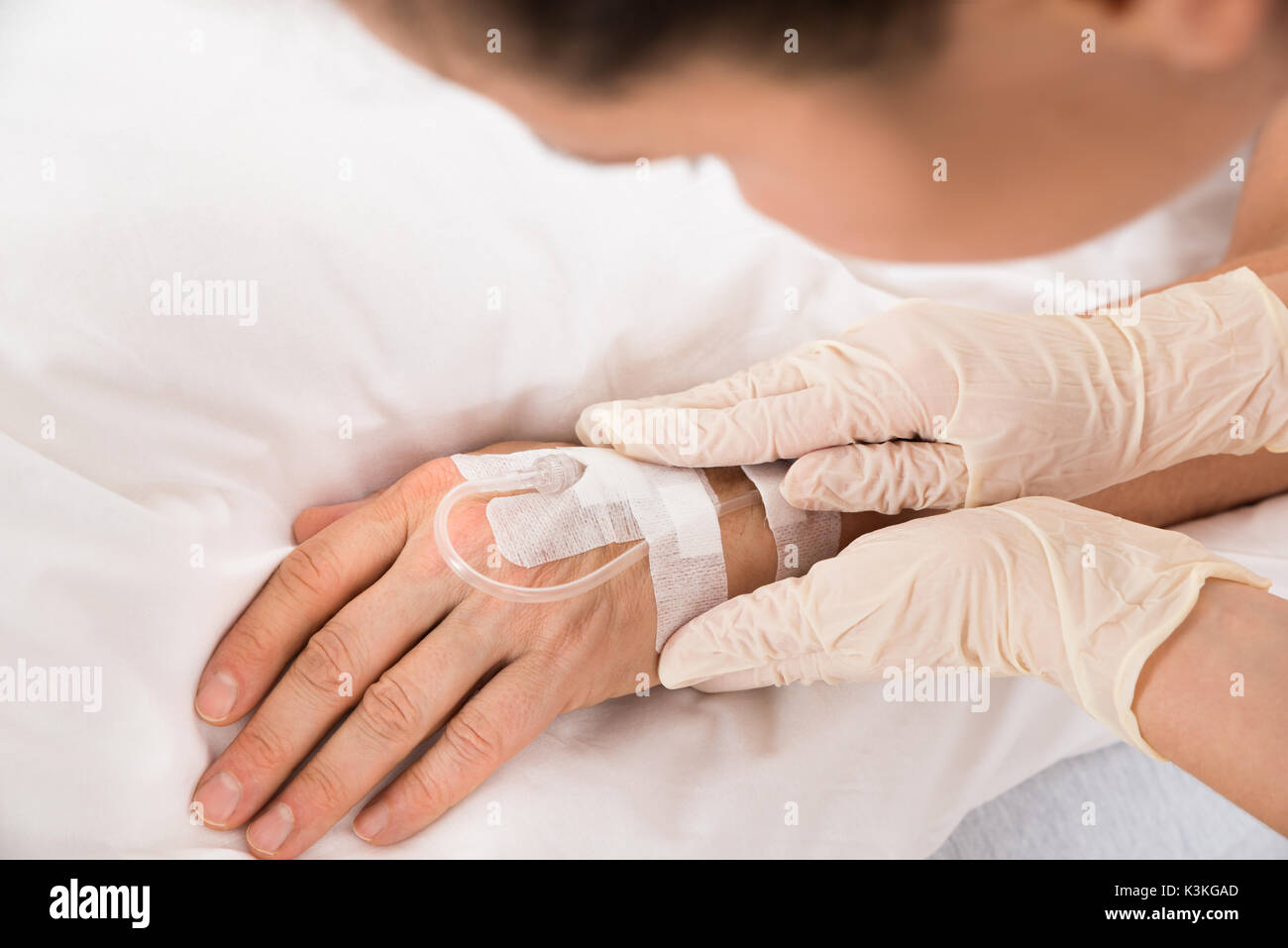 Close-up Of Female Doctor's Hand With Iv Drip Inserted In Patient's ...