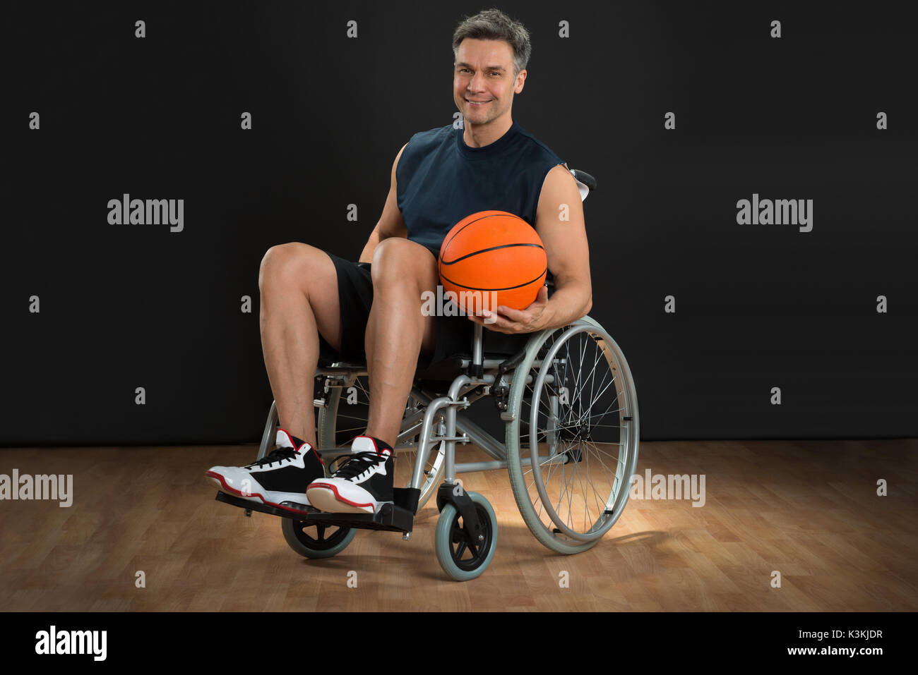 Portrait Of A Disabled Player On Wheelchair Holding Basketball Stock ...