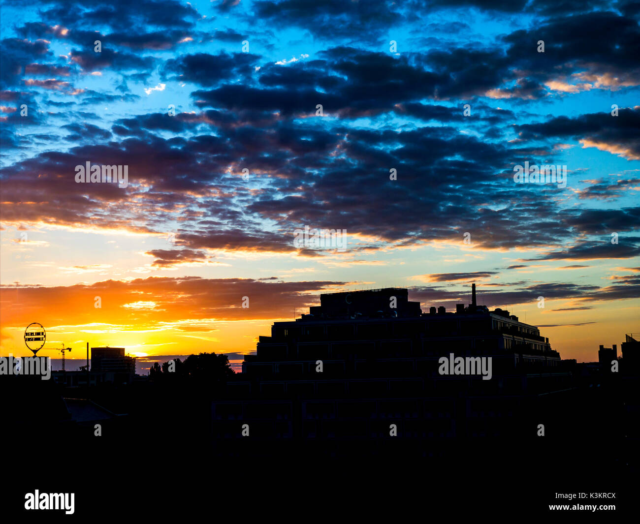 Setting sun over the cityscape of Berlin Stock Photo - Alamy