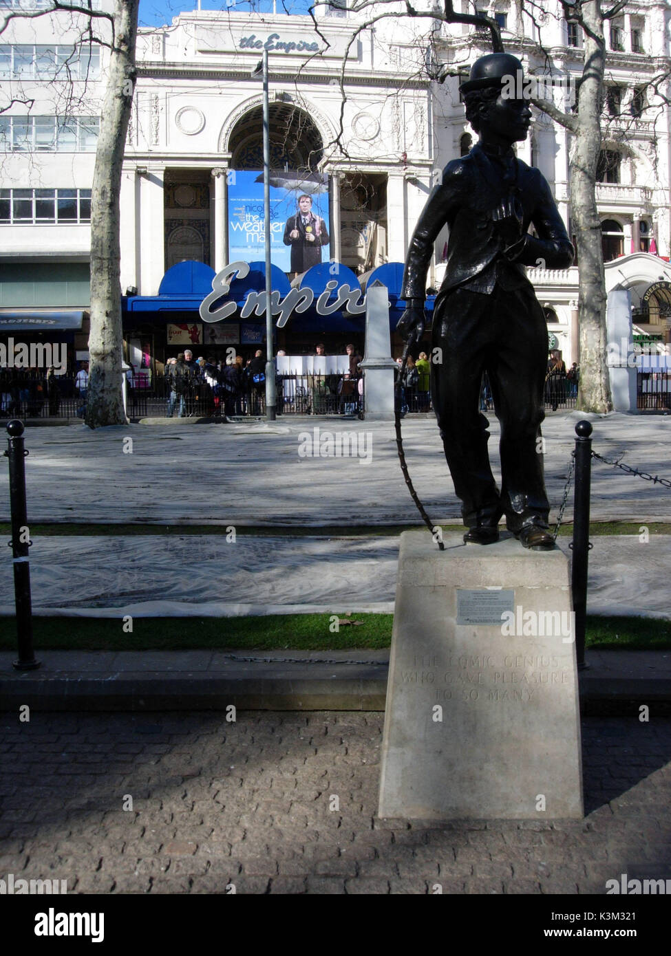 CHARLIE CHAPLIN STATUE IN LEICESTER SQARE LONDON WITH THE EMPIRE ...