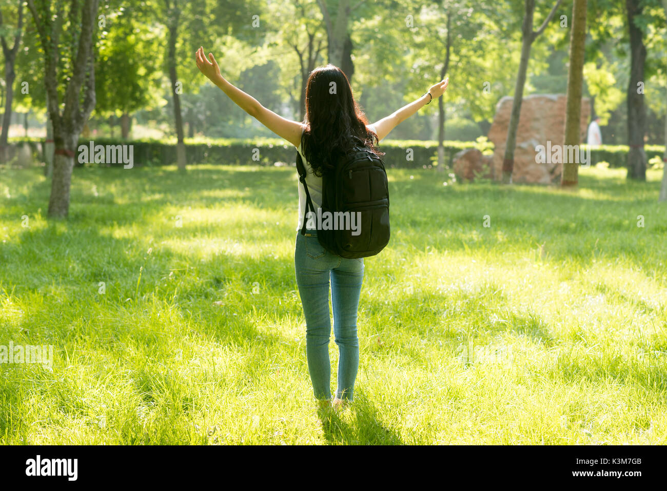 Girl basking in the sun on the grove Stock Photo - Alamy