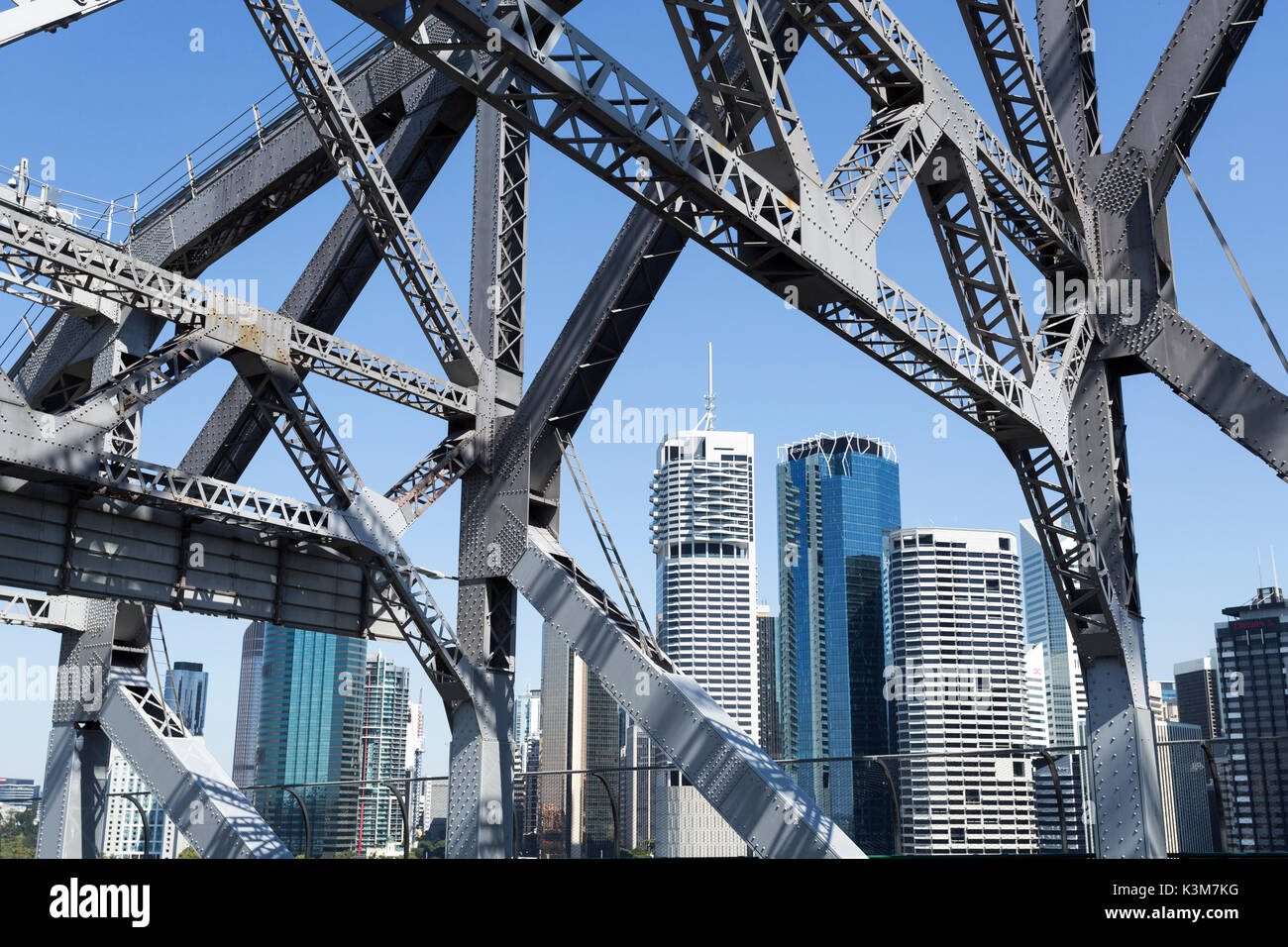 The cityscape seen through the steel trusses of the Story Bridge in ...