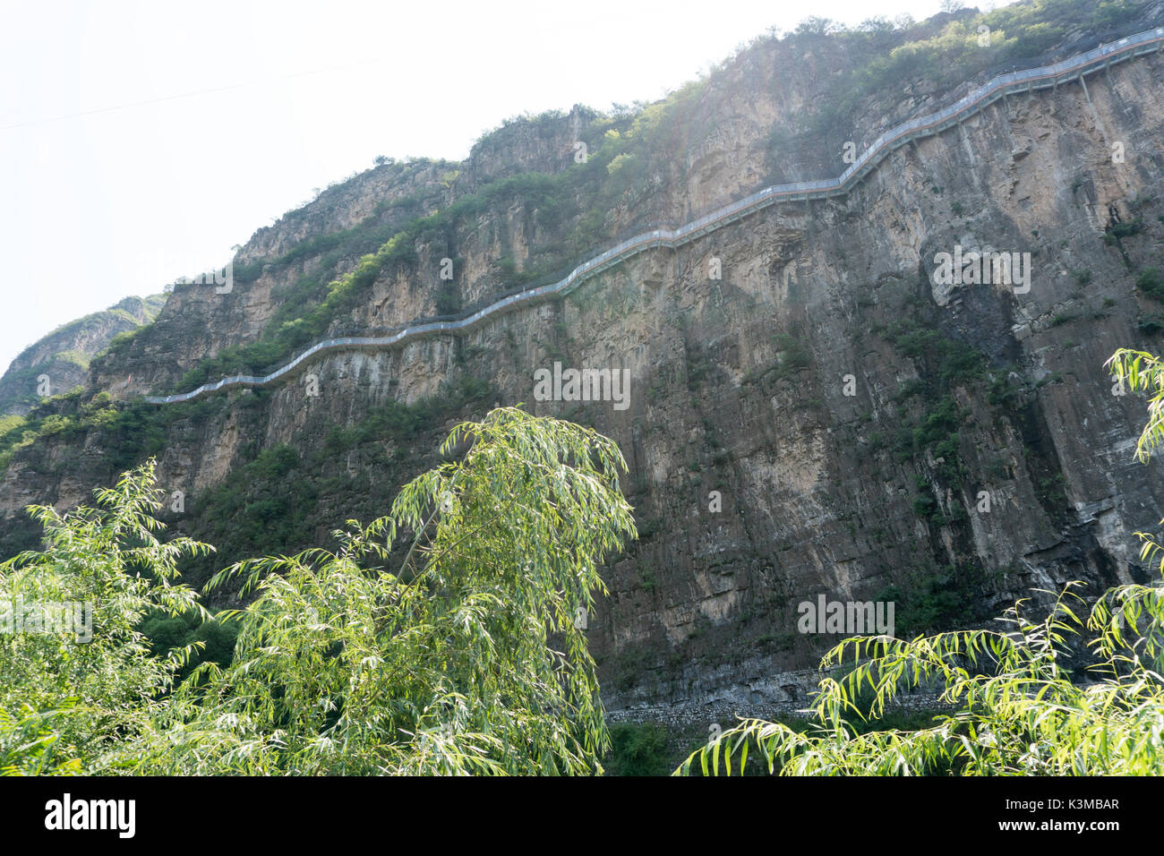 Tourism scenic spot of a glass road built along the face of a cliff ...