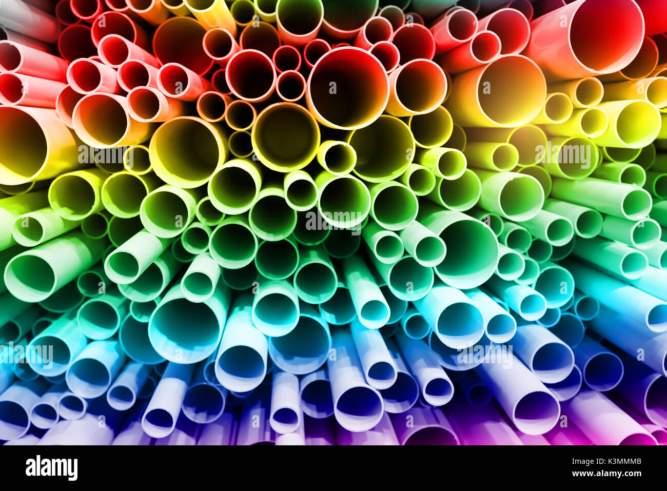 color rainbow of PVC pipes stacked in construction site Stock Photo - Alamy