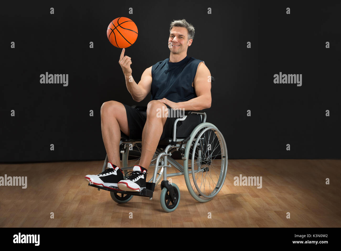Disabled Basketball Player On Wheelchair Spinning Ball On His Finger ...