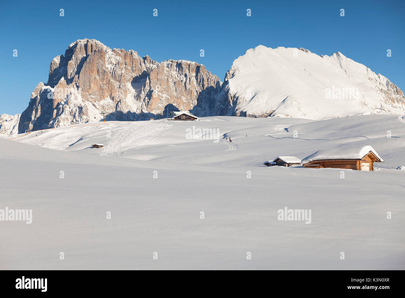 a winter landscape of the Seiser Alm with beautiful meadows full of ...