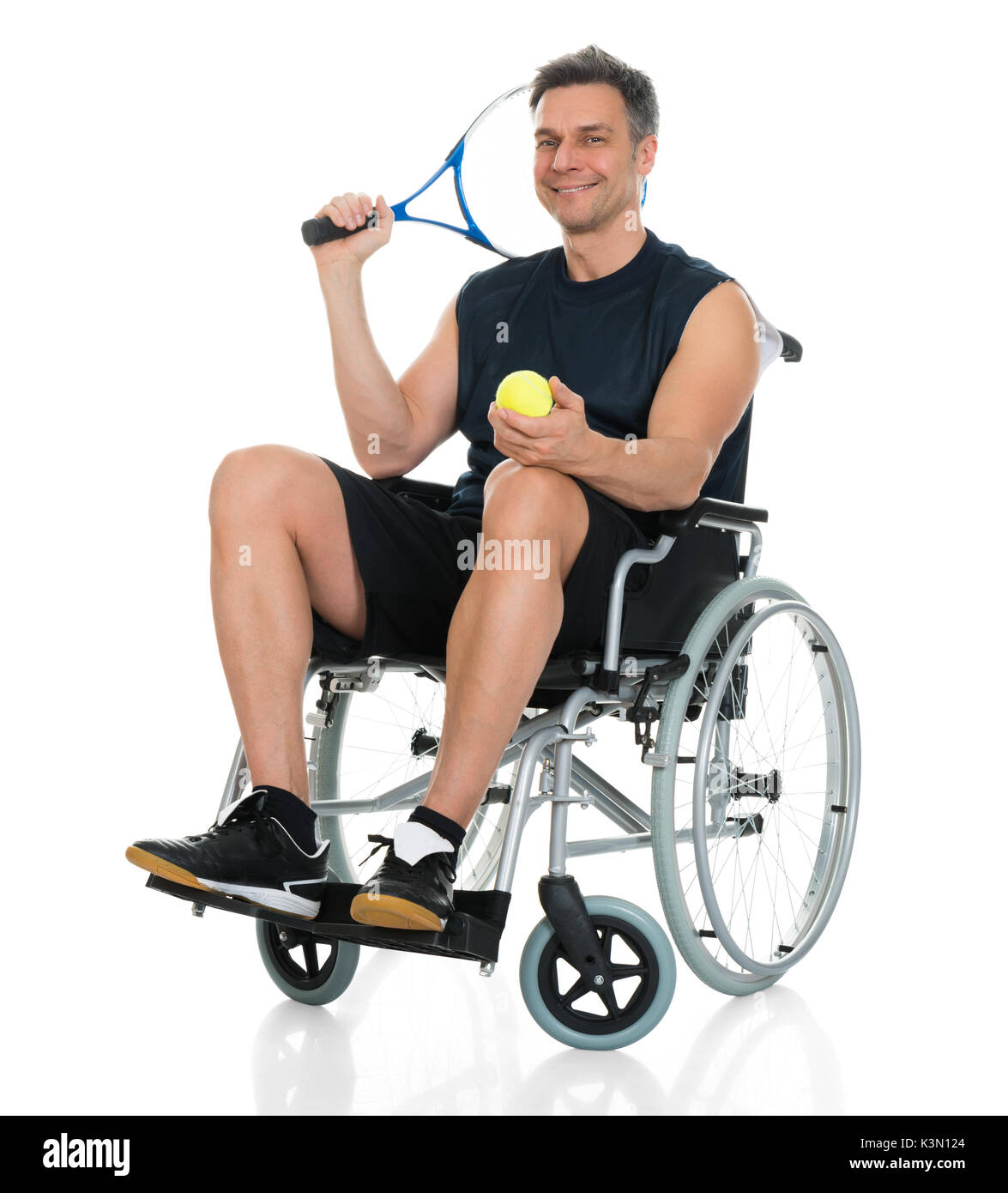 Smiling Disabled Man On Wheelchair Holding Racket And Ball Stock Photo ...