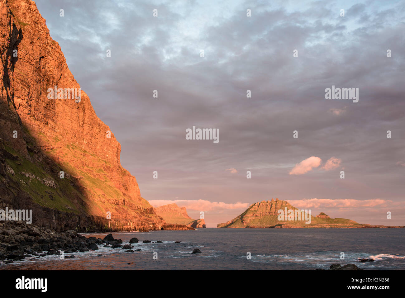 Vagar island, Faroe Islands, Denmark. Sunset over Tindholmur islet ...