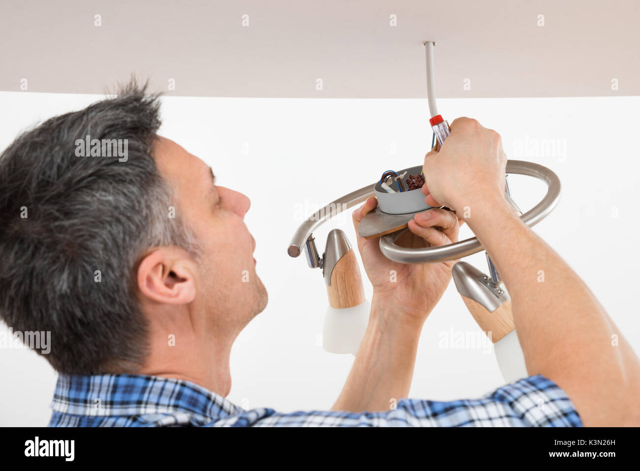 Installing ceiling light wiring hi-res stock photography and images - Alamy