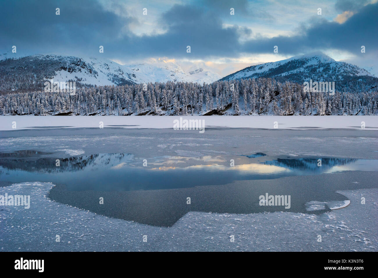 Frozen alpine lake in winter. Engadine, Switzerland Stock Photo - Alamy