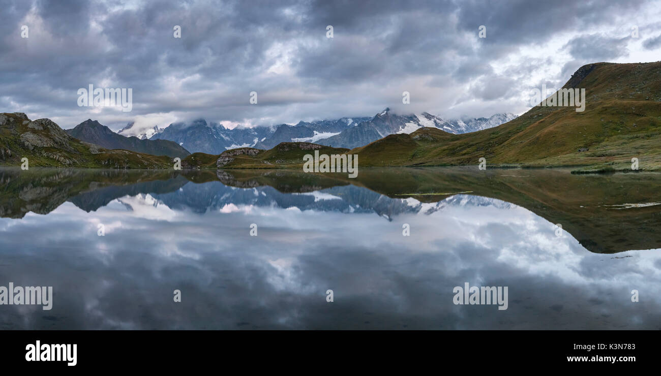 Cloudy sky over Fenetre Lake and the Mont Blanc massif, Ferret valley ...