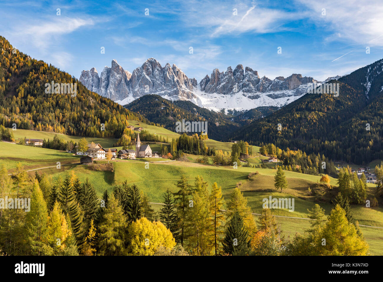 Autumnal landscape with Odle Dolomites peaks on the background. Santa ...