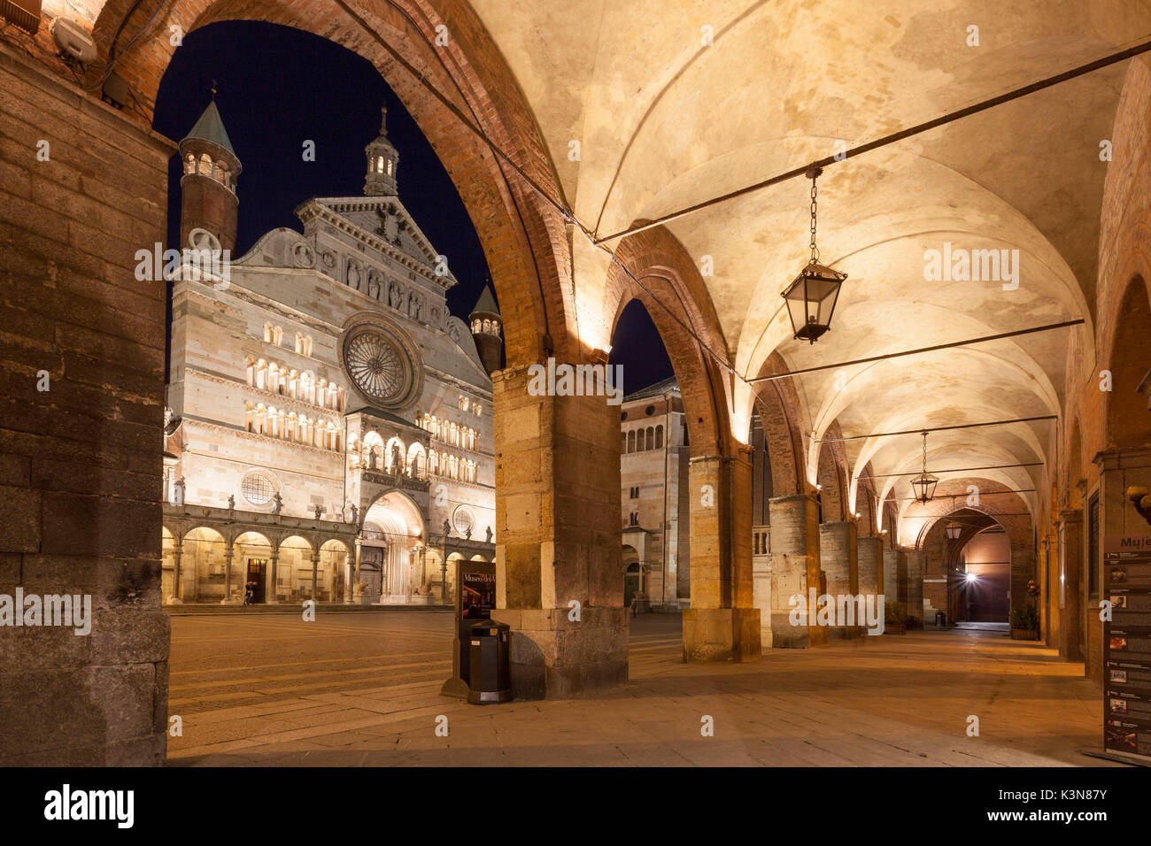 Cremona, Lombardy, Italy. Arcade of town hall and the cathedral in the ...