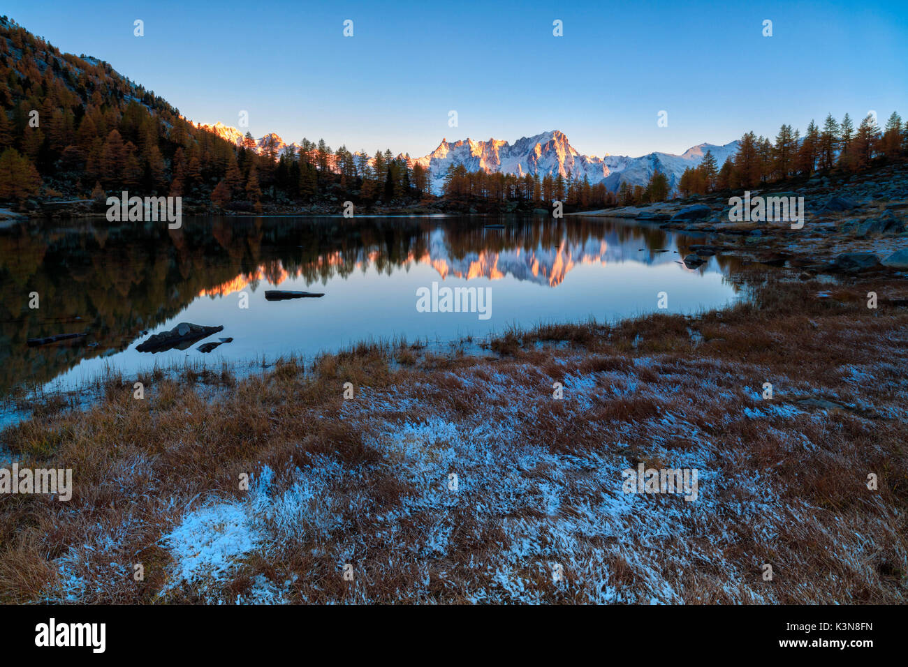 Gran jorasses reflects in autumn in arpy lake hi-res stock photography ...