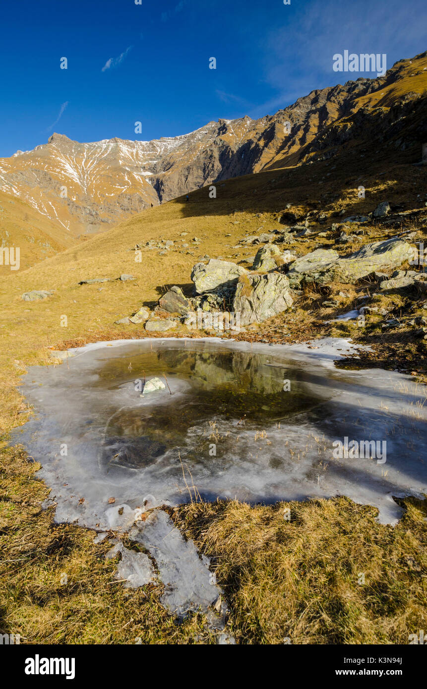 Little alpine lake frozen (Soana Valley, Gran Paradiso National Park ...