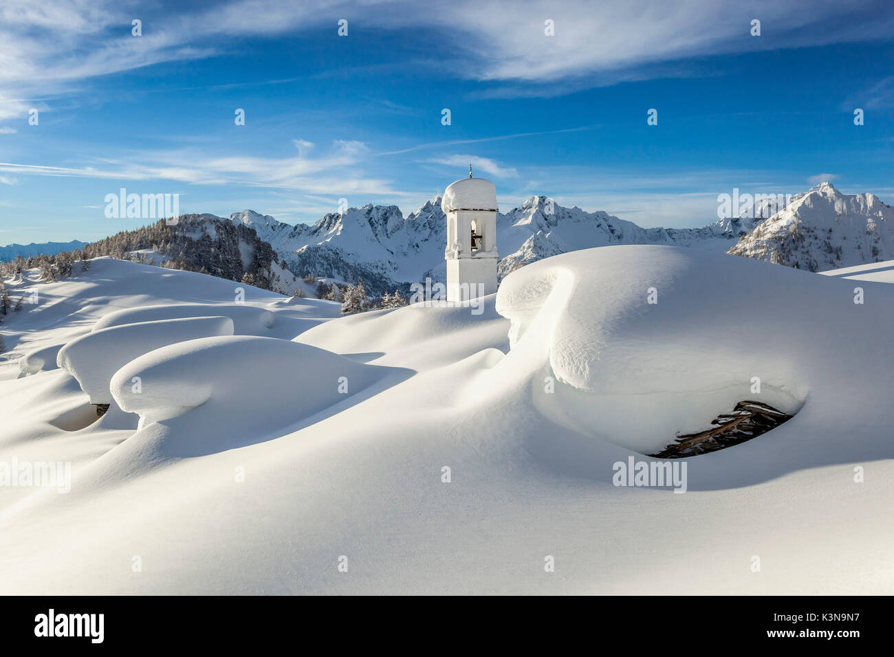 Italy, Italian Alps, Lombardy, The huts and the bell tower of Alpe Cima ...