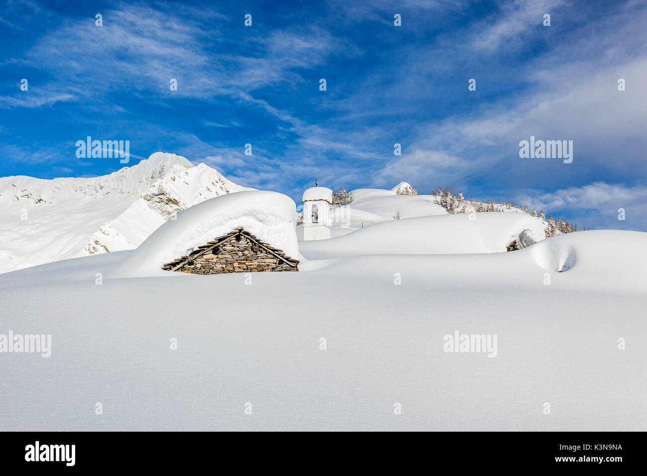 Italy, Italian Alps, Lombardy, The huts and the bell tower of Alpe Cima ...