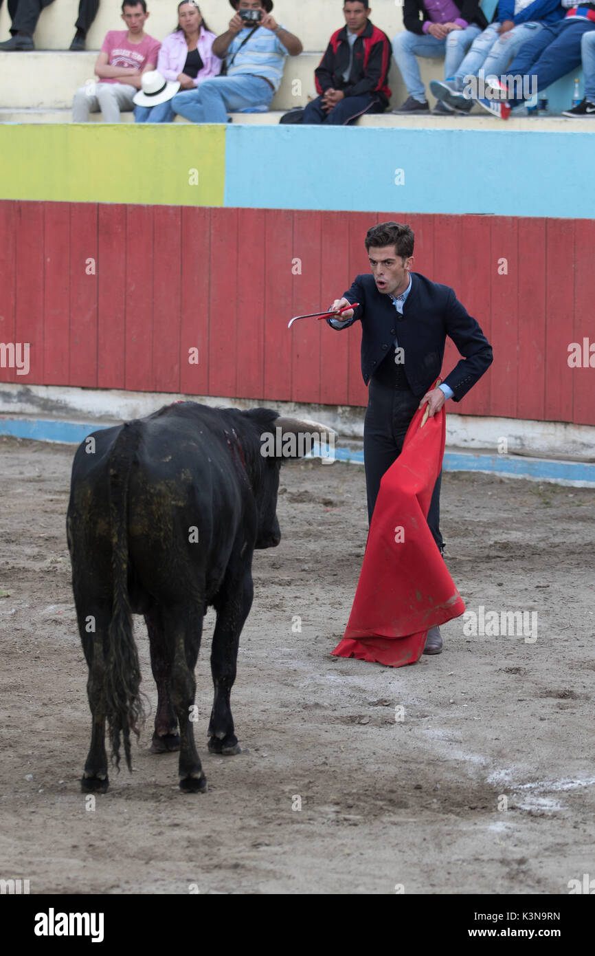 June 18, 2017 Pujili, Ecuador: bullfighter holds up his sword towards ...