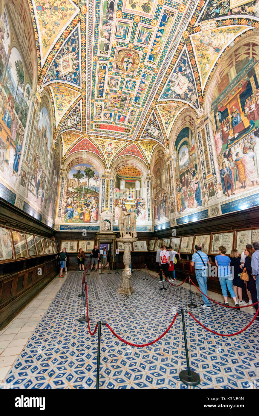 Tourists inside the Piccolomini Library of Siena Cathedral. Europe ...