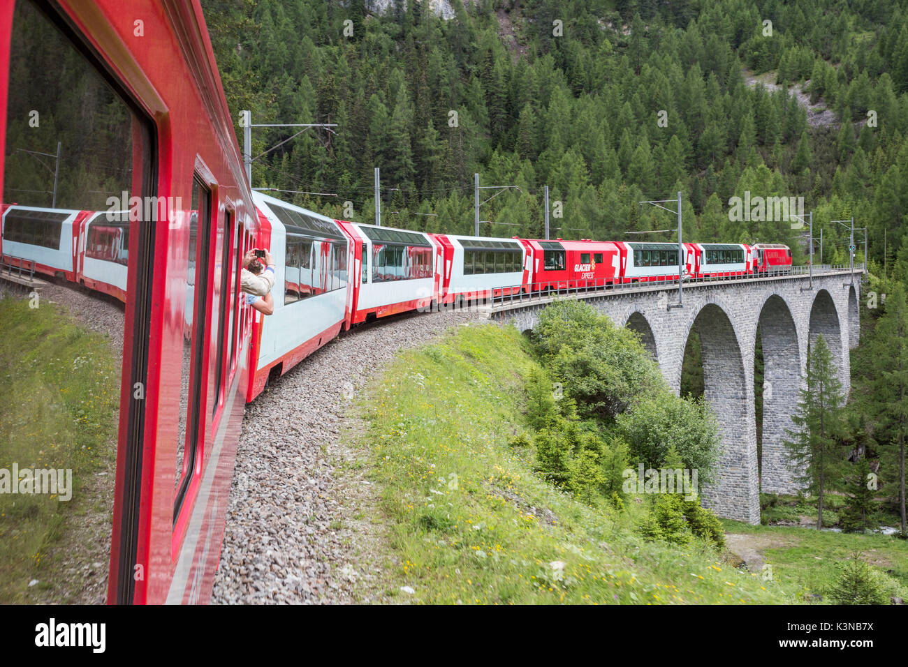 Red train Bernina Express, Graubunden, Switzerland Stock Photo - Alamy