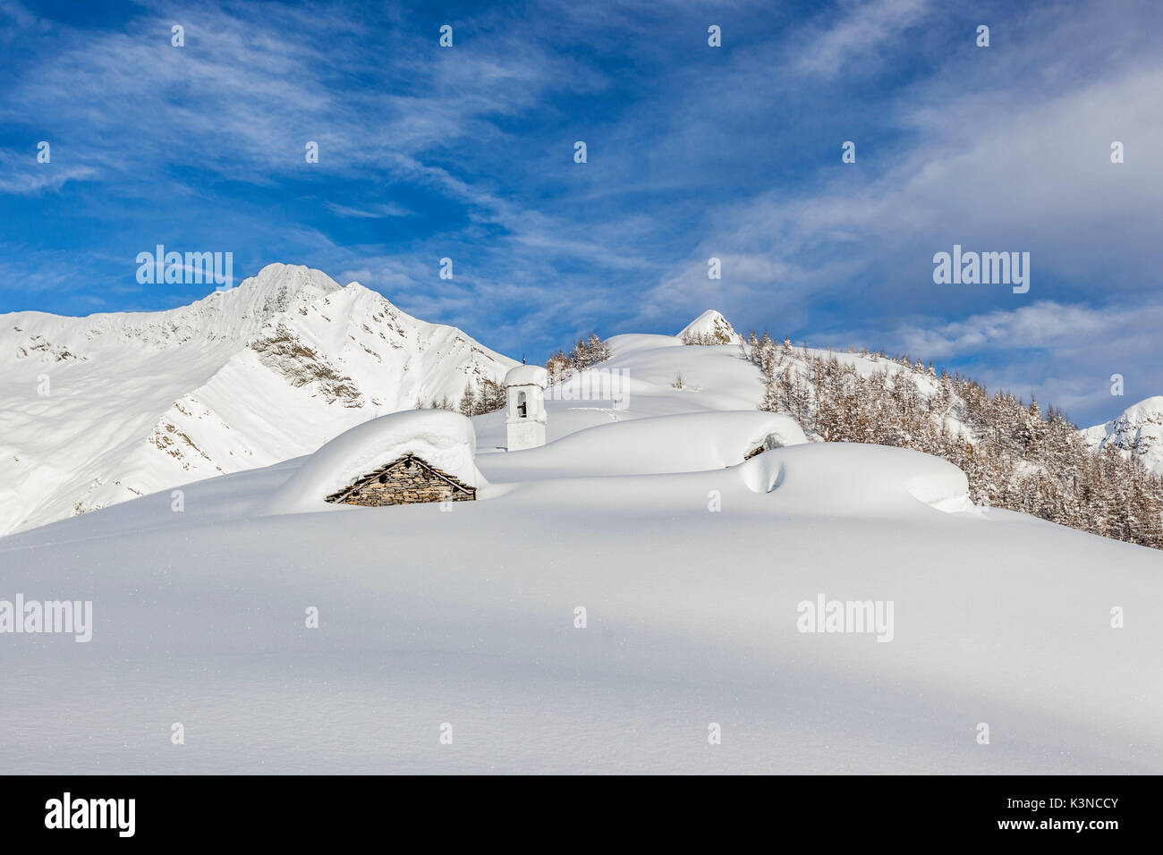 Italy, Italian Alps, Lombardy, The huts and the bell tower of Alpe Cima ...
