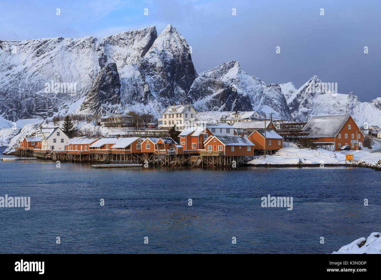 Snowy jagged mountains over the sea shore, Moskenes, Lofoten islands ...