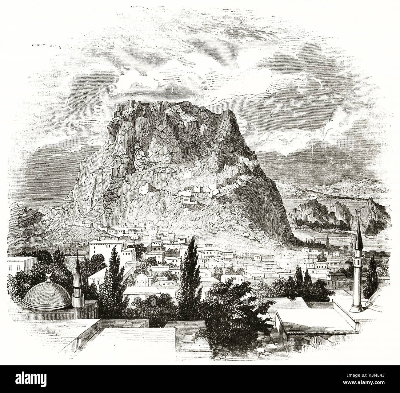 ancient medieval middle oriental city at the foot to a rocky mountain ...