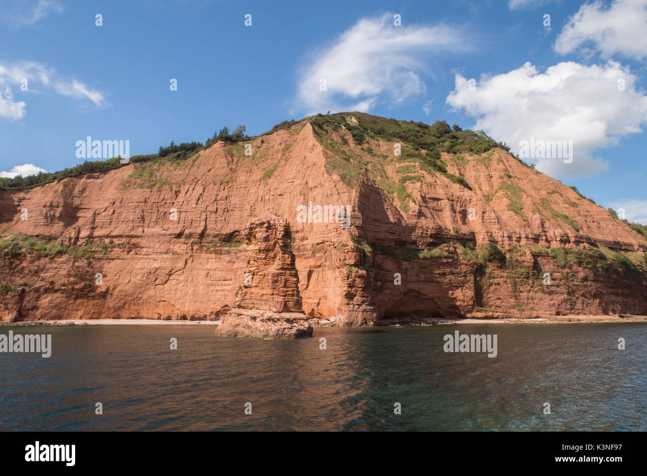 High Peak rises above a triassic rock stack near Ladram Bay, Sidmouth ...