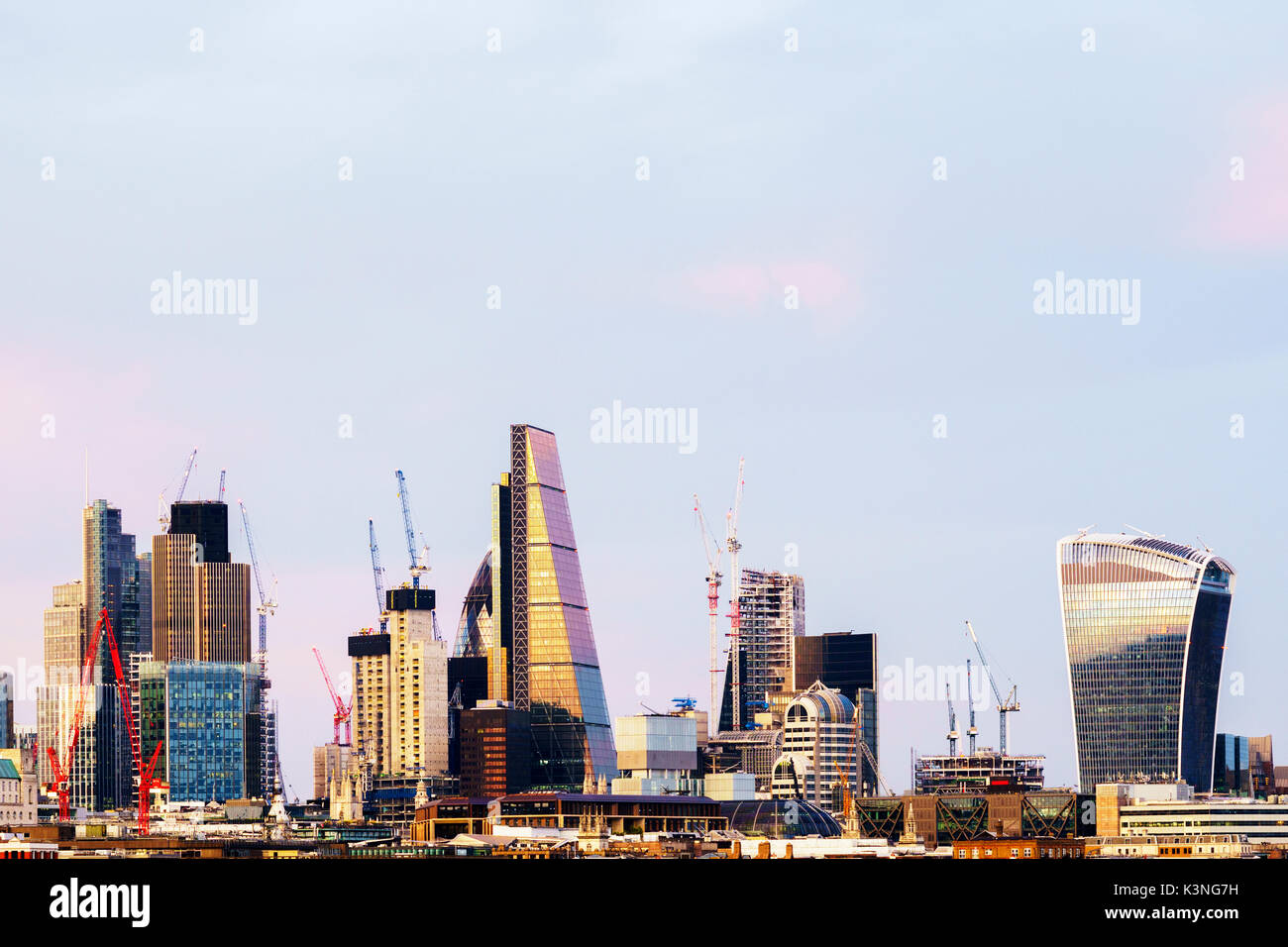 Modern London architecture and the construction of city skyscrapers lit ...