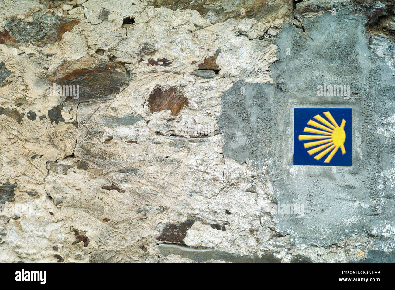 The yellow scallop shell signing the way to santiago de compostela on ...