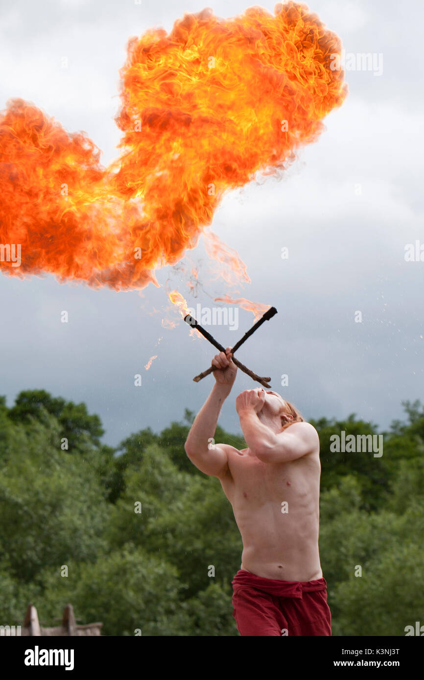 Fire breather, Farren, blows a firey heart shape in the air during his ...