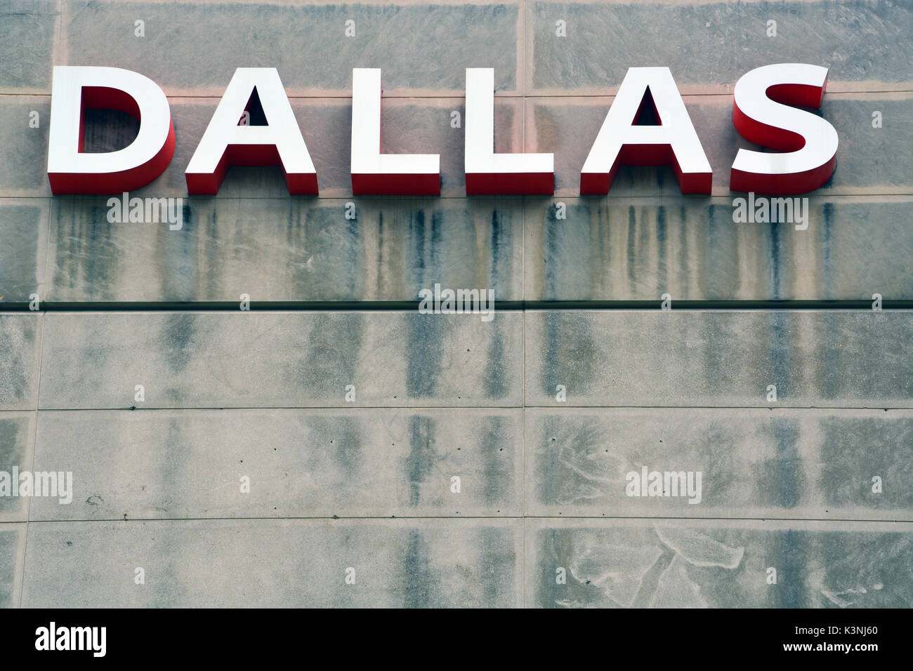 Dallas headline: white letters with red highlights on a weathered ...