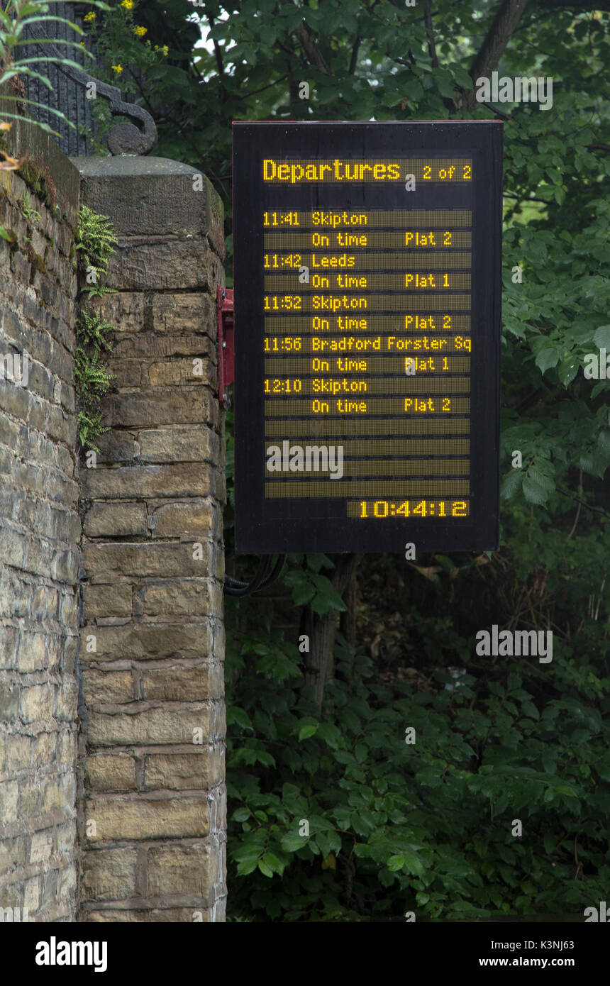 A live departures board on the wall at Saltaire railway station Stock ...