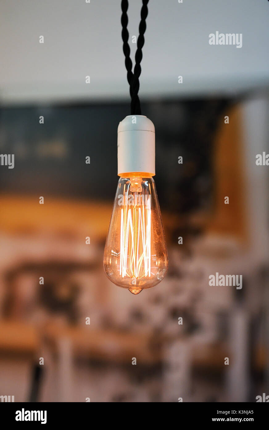 Old dusty light bulb glowing in the dark Stock Photo - Alamy