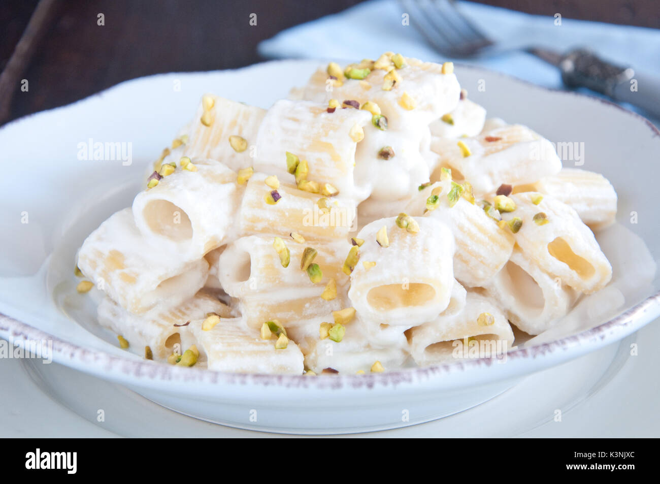 Pasta with fresh ricotta and pistachio grain,italy Stock Photo - Alamy