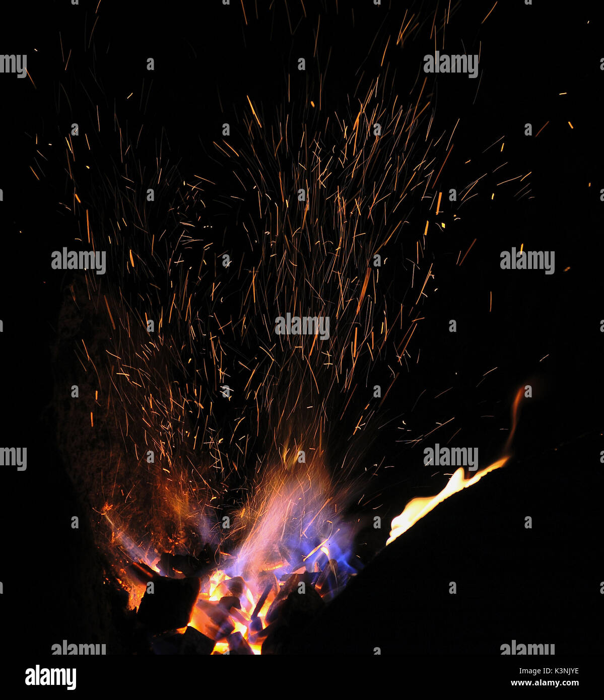 Smithy fire flame tips with sparks closeup on dark background Stock ...