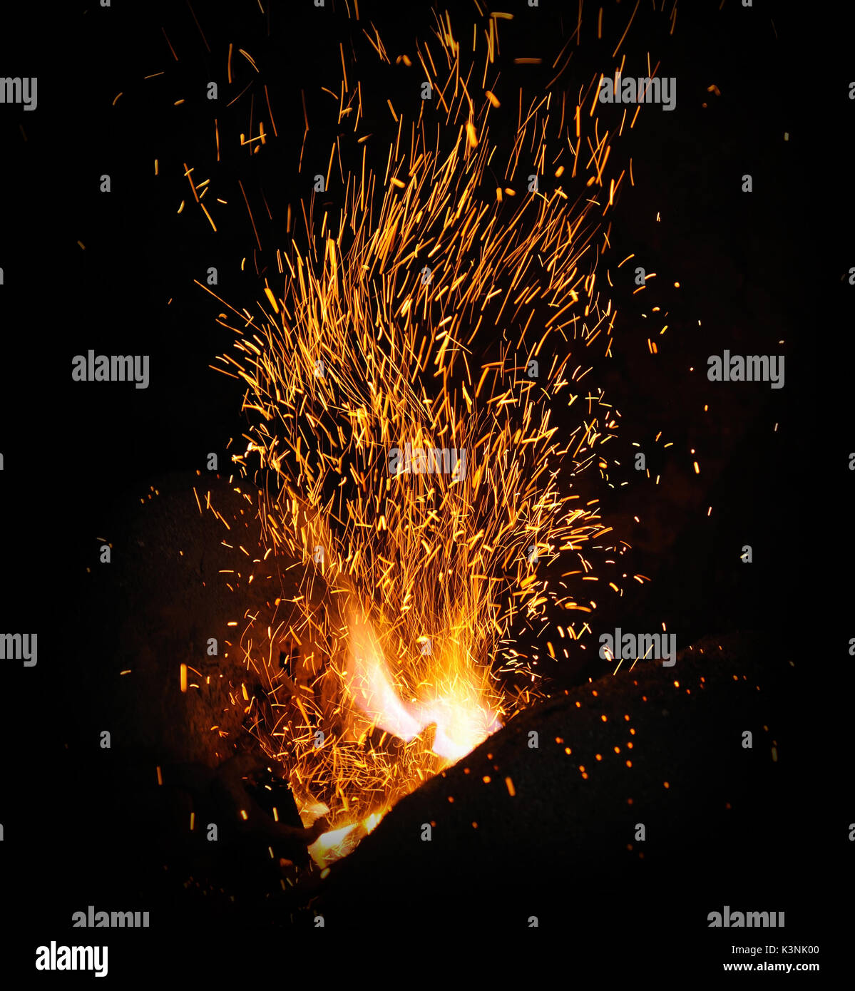 smithy fire flame tips with sparks closeup on dark background Stock ...