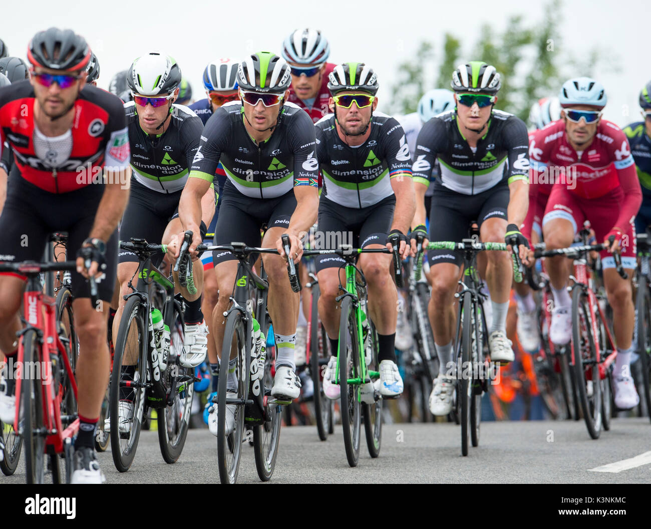 Great Britain's Mark Cavendish (centre) rides with his Dimension Data ...