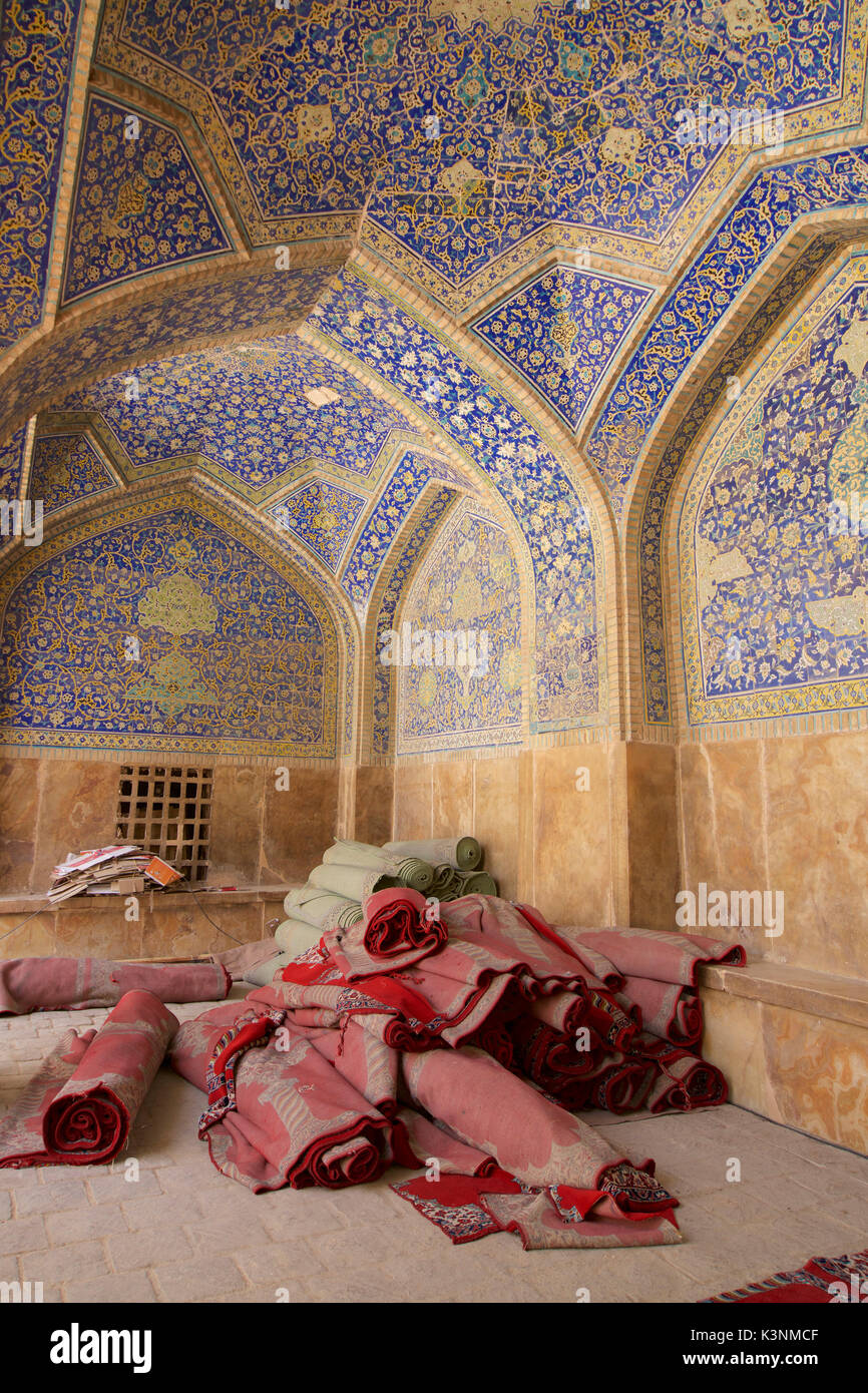 Rolled up prayer rugs, at the Imam Mosque. Isfahan, Iran Stock Photo ...