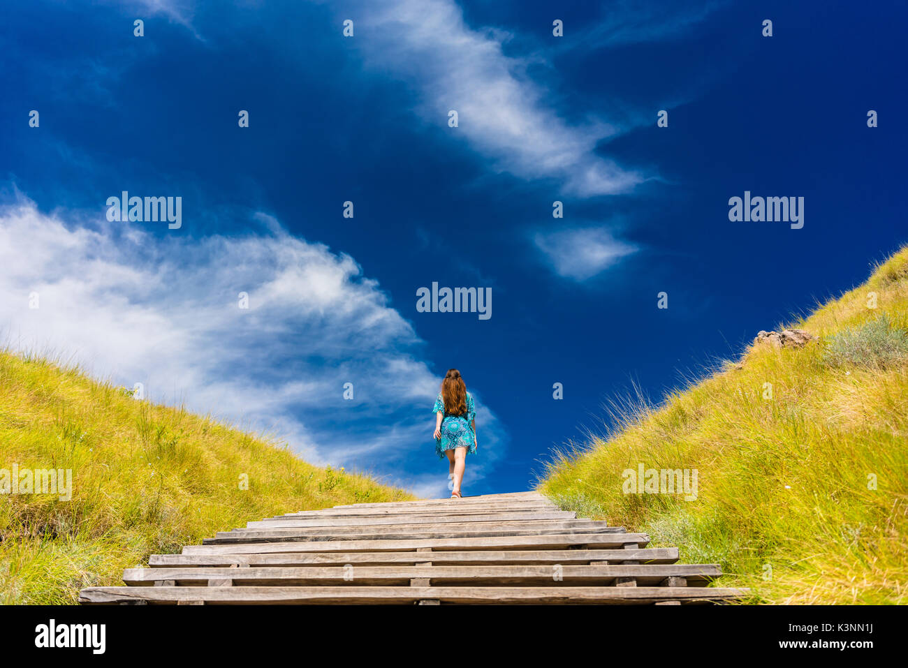 Woman climbing stairs hi-res stock photography and images - Alamy
