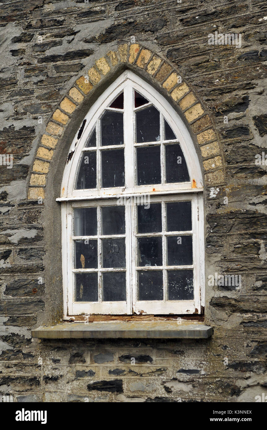 an arched window in an old weslian Baptist gothic inspired schoolroom ...