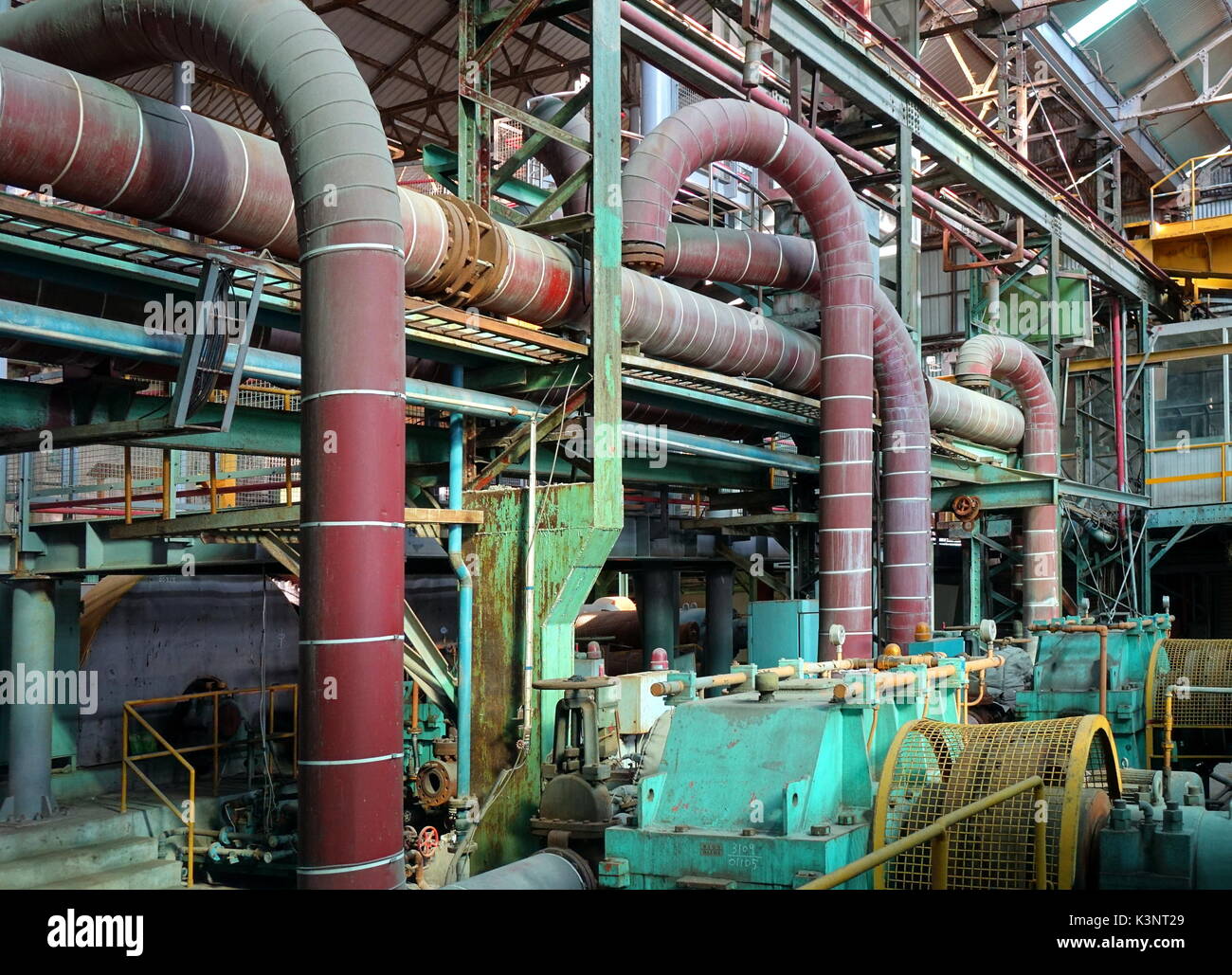 An abandoned old factory with large industrial equipment Stock Photo ...