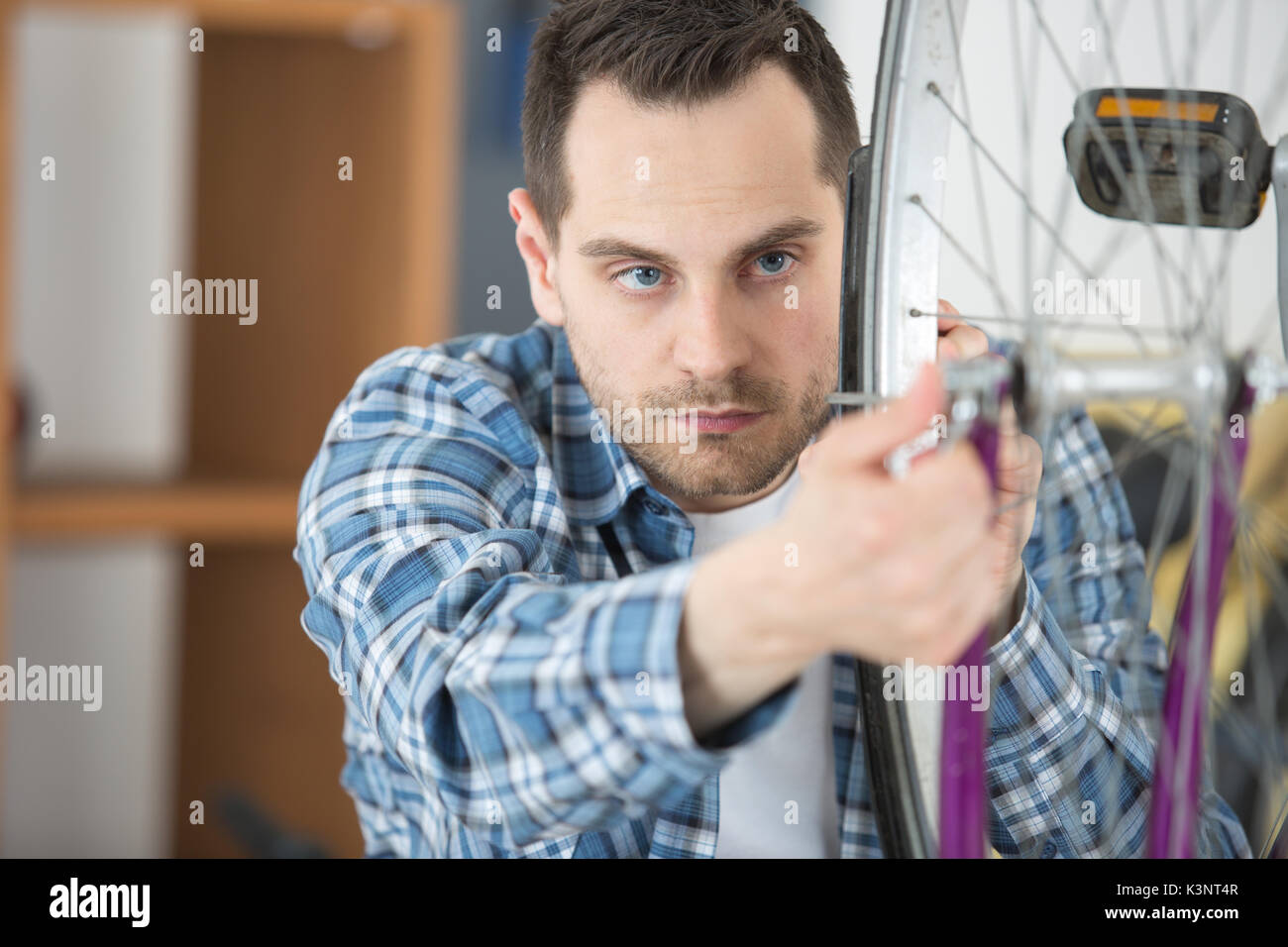 man pumping wheel bike Stock Photo - Alamy