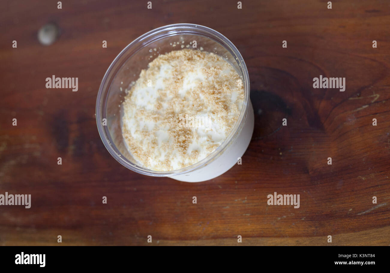 Single serving of vanilla pudding in a small, clear container Stock ...