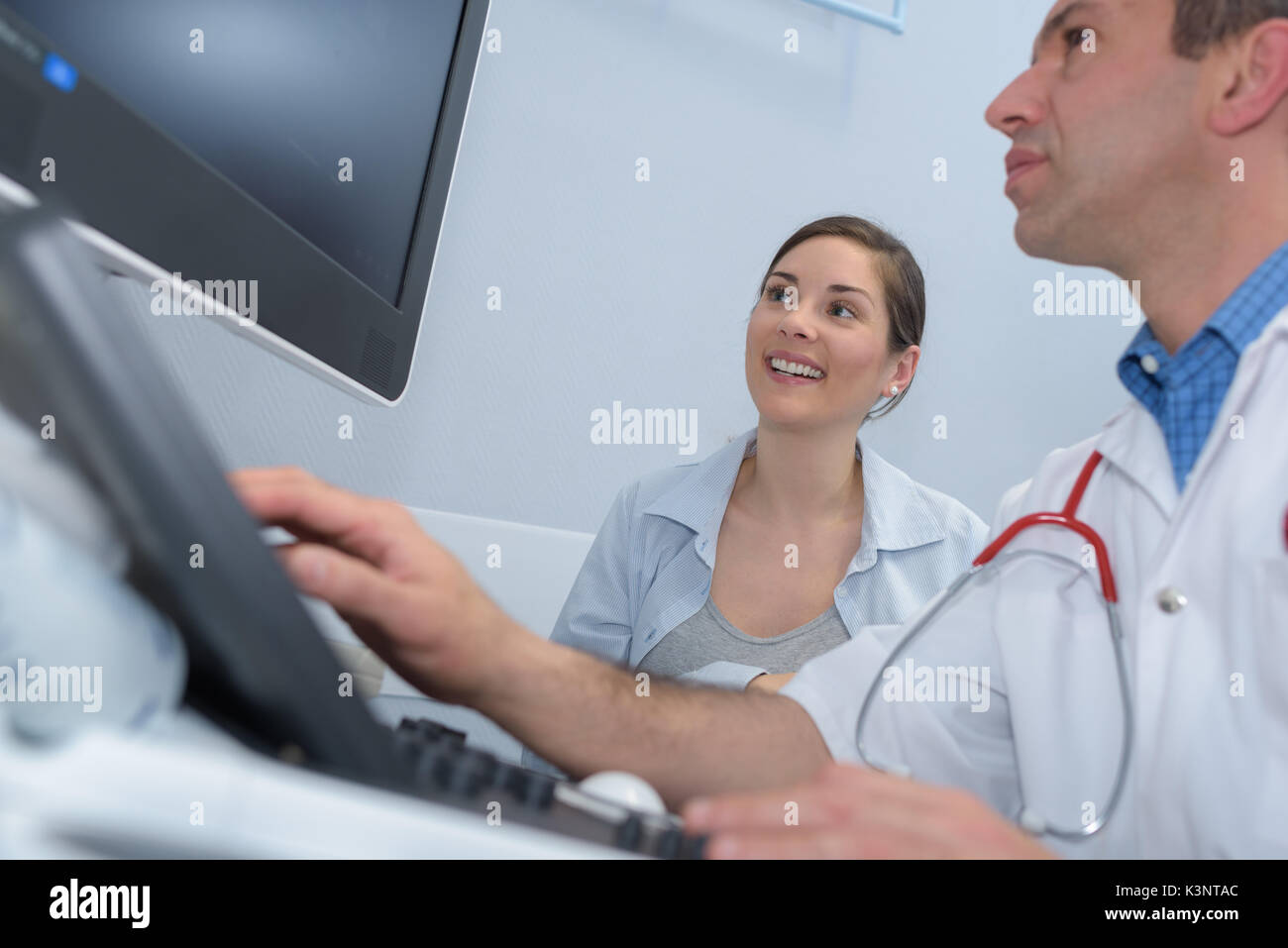 doctors or nurses on computer screen Stock Photo - Alamy