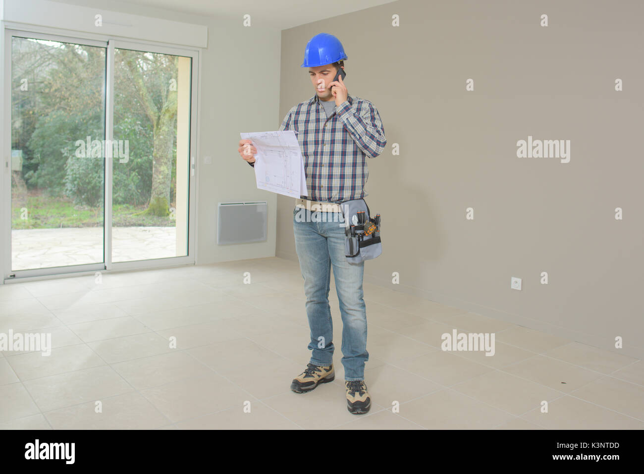 worker standing in a construction Stock Photo - Alamy