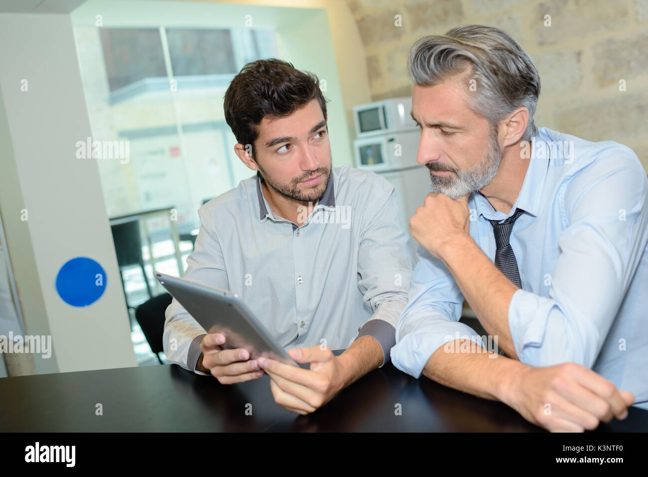 Sharing good news hi-res stock photography and images - Alamy