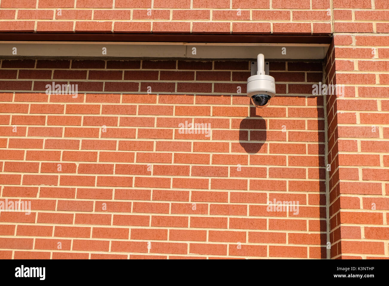 CCTV camera at a red brick wall, secutity Stock Photo - Alamy